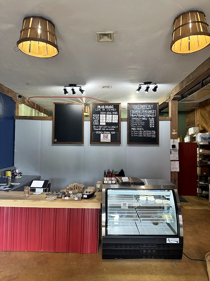 Inside, wooden bucket light fixtures cast a warm glow over chalkboard menus, creating the perfect no-nonsense atmosphere for serious seafood enjoyment.