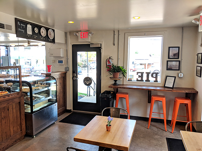 Inside, the cozy industrial-chic space invites you to linger over coffee and pastries while contemplating the meaning of butter-based happiness.