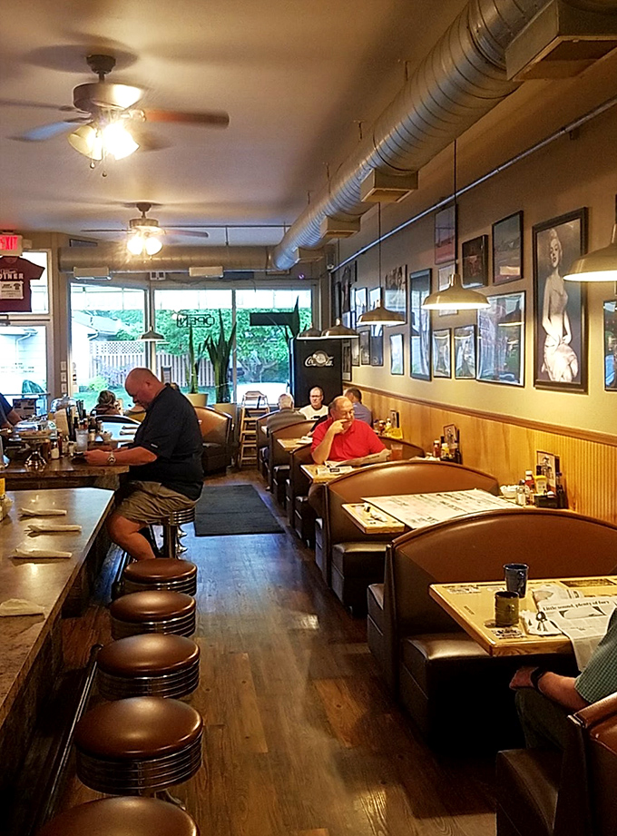 Classic diner perfection: wooden booths where strangers become neighbors and the counter seats offer front-row tickets to the breakfast show.