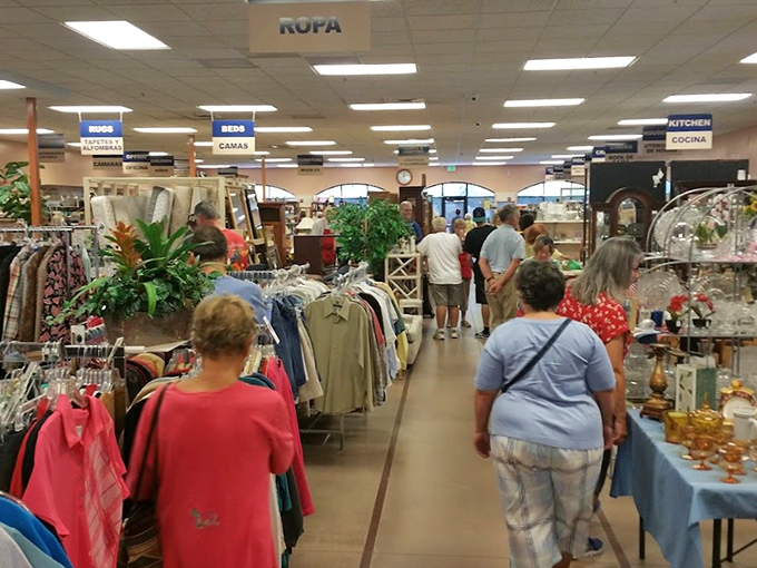 Organized chaos at its finest&mdash;shoppers navigate a labyrinth of clothing racks and home goods with the focus of archaeologists.