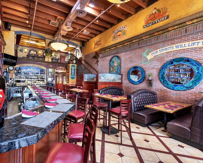 Step inside and you're greeted by warm wood, exposed brick, and nautical touches that say "upscale dining" while still letting you know flip-flops are welcome.