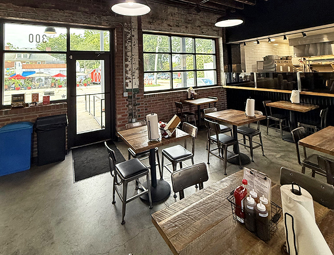 Industrial-chic meets Southern hospitality inside, where exposed brick walls and wooden tables create the perfect stage for the meat theater about to unfold.