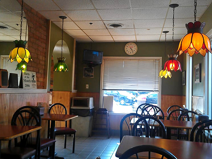 Tiffany-style lamps cast a warm glow over the dining area, creating an atmosphere that's part Italian grandmother's house, part 1970s time capsule&mdash;in the best possible way.