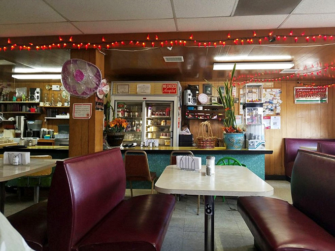 Step inside and time stands still &ndash; burgundy vinyl booths, wood paneling, and festive chili pepper lights create the kind of authentic diner atmosphere money can't manufacture.