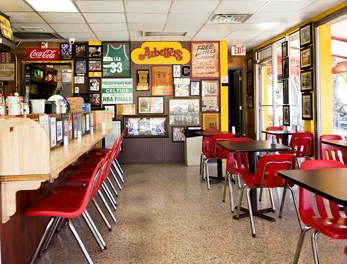 Red chairs and sports memorabilia create the perfect no-nonsense atmosphere for serious chili dog consumption.