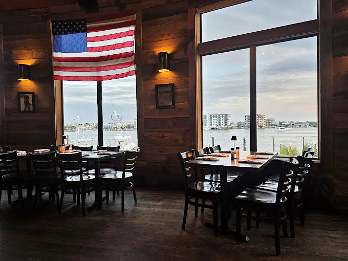 Where American pride meets waterfront dining. Those windows frame a million-dollar view that no interior designer could improve upon.