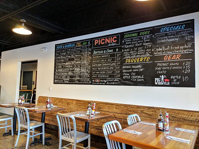 The chalkboard menu looms like a roadmap to happiness, with wooden tables below standing ready for the impending feast. Decision paralysis has never been so delicious.