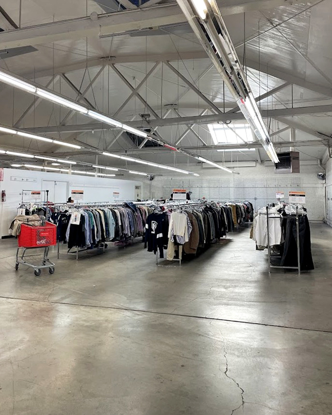Endless racks under industrial ceilings create a treasure hunter's paradise where your next favorite outfit is hiding in plain sight.