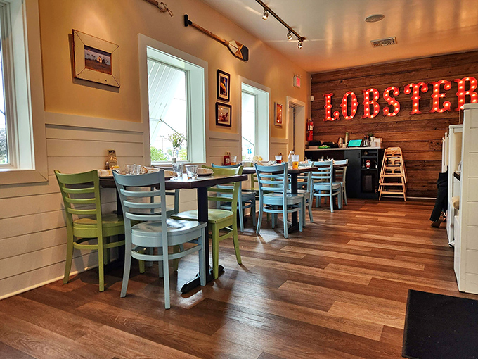 Inside, that glowing "LOBSTER" sign isn't just d&eacute;cor&mdash;it's a neon-lit promise of the maritime treasures awaiting at your sea-foam colored table.
