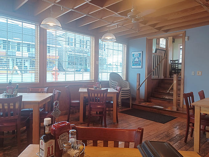 Sunlight and simplicity meet where wooden tables await their next crab shell symphony.