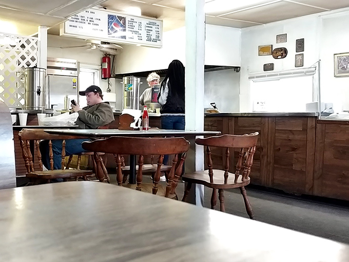 Simple wooden chairs and tables await hungry patrons inside B's, where the focus is squarely on the food, not fancy furnishings.