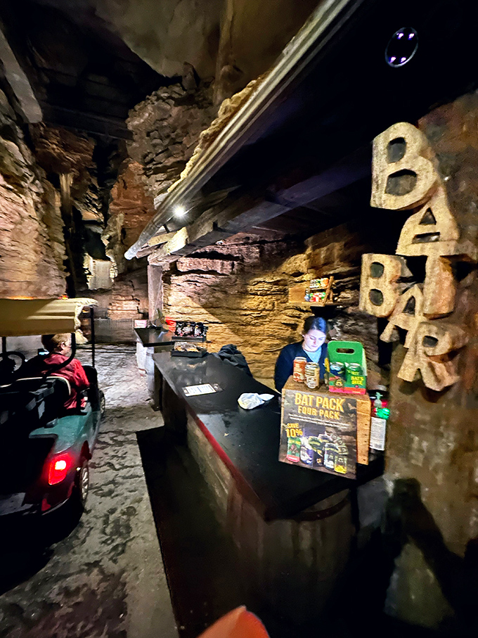 Inside the cave, limestone walls create intimate dining spaces that feel both ancient and inviting.