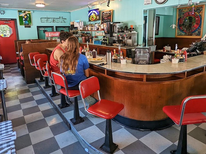 Classic diner perfection with mint walls, checkered floors, and those swivel stools that make everyone feel like a regular.