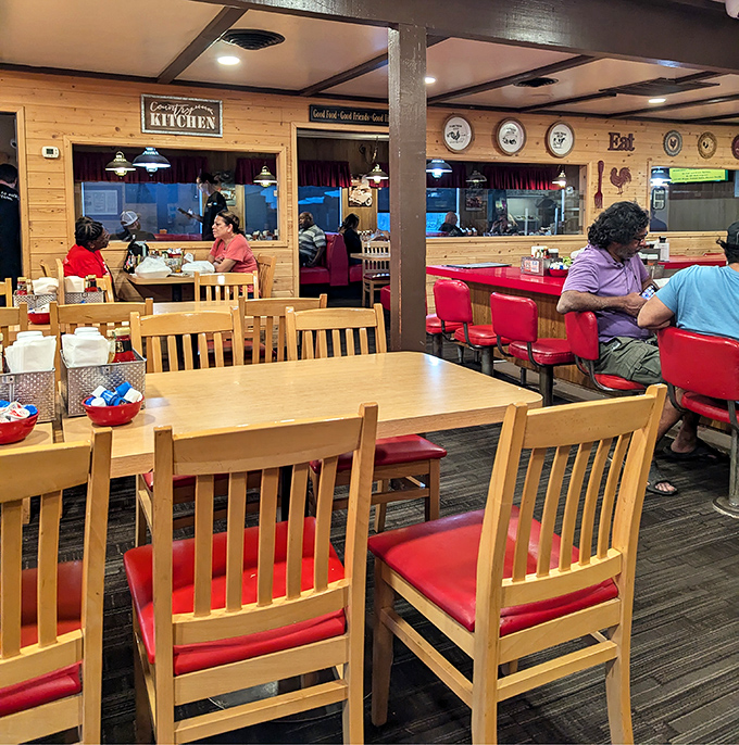 Classic diner comfort meets cabin-cozy vibes inside, where those red vinyl seats aren't just for sitting &ndash; they're thrones for pancake royalty.