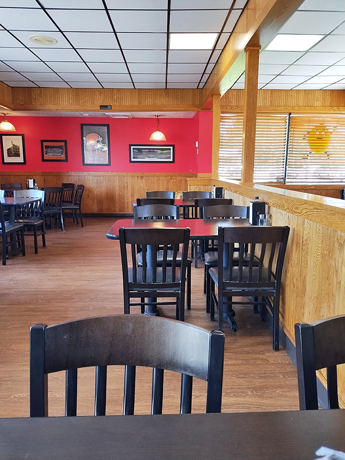 Wood paneling and red walls create that perfect "been here forever" vibe. Where comfort meets nostalgia in every corner.
