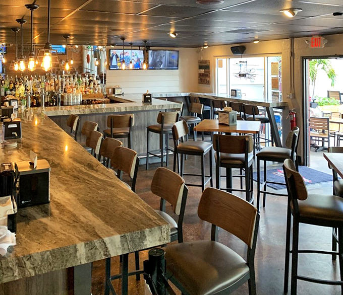 Step inside and you're greeted by a riot of color &ndash; yellow beams, vibrant tablecloths, and windows that frame the harbor like living paintings.