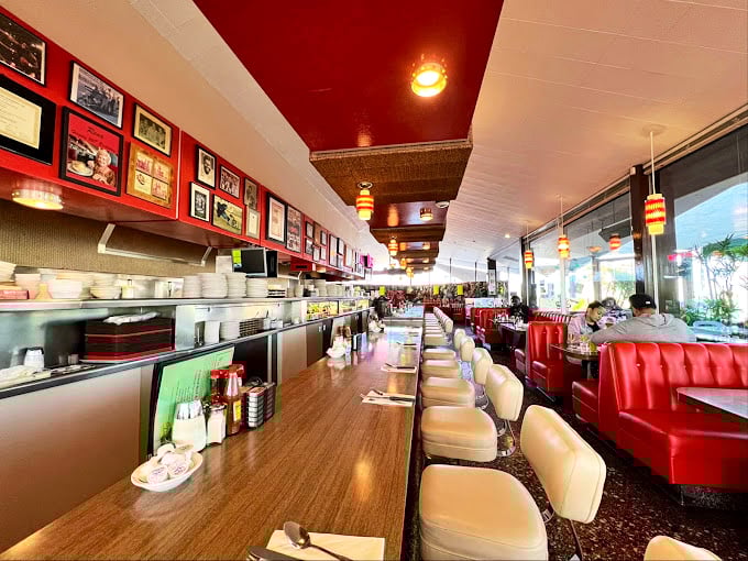 Mid-century modern meets comfort food heaven where red vinyl booths invite you to slide in and stay awhile.