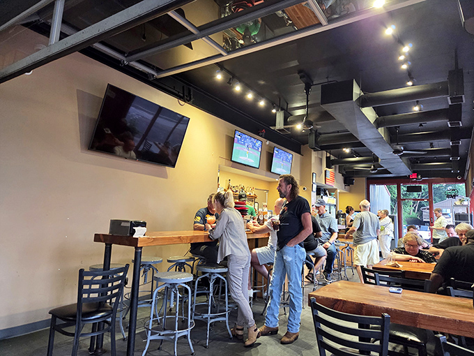 Inside, industrial-chic meets comfort with exposed ceiling elements and warm wood tables&mdash;the perfect backdrop for the smoky drama about to unfold on your plate.