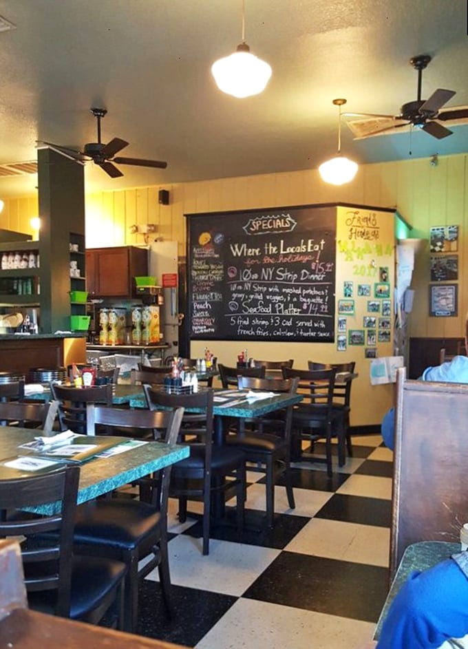 Classic black and white checkered floors, chalkboard specials, and ceiling fans spinning lazily overhead&mdash;this isn't just a diner, it's a time machine with better food.