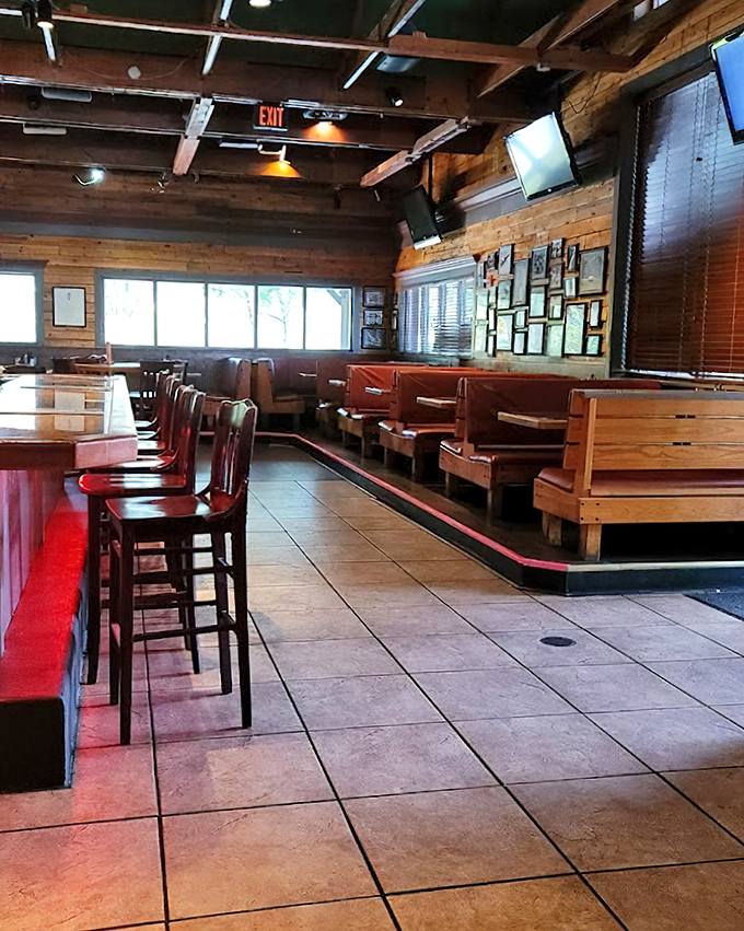 Wooden booths and exposed beams create that perfect "mountain cabin meets sports bar" vibe where comfort is king and napkin consumption rivals food consumption.