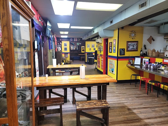 Vibrant yellow walls and rustic wooden tables create the perfect backdrop for the impending flavor explosion. Simplicity with a side of personality.