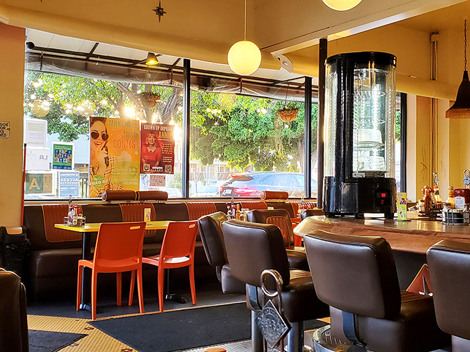 Inside, retro meets modern with globe pendant lights casting a warm glow that makes everyone look like they're starring in their own indie film.