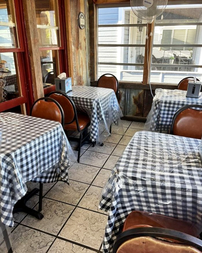 Classic black and white checkered tablecloths set the stage for barbecue theater. No fancy linens needed when the star of the show is slow-smoked perfection.