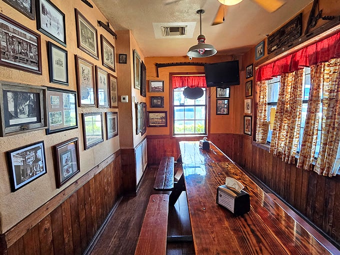 History lines these walls like smoke penetrates meat. Each photo and memento tells a story of barbecue tradition that's as rich as the food.