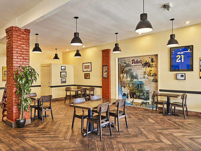 Yellow walls and herringbone floors create the perfect backdrop for food that demands your full attention and loosened belt notches.