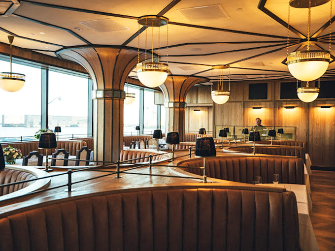 Modern elegance meets old-school glamour at the entrance, where that wooden bull emblem silently promises the carnivorous delights waiting inside.