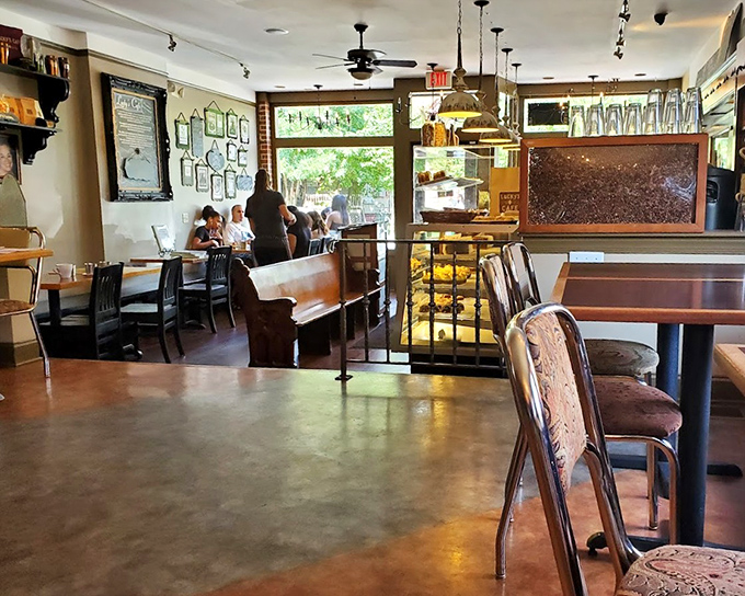 Inside, vintage charm meets modern comfort with exposed brick, wooden tables, and an atmosphere that whispers, "Stay awhile, calories don't count here."