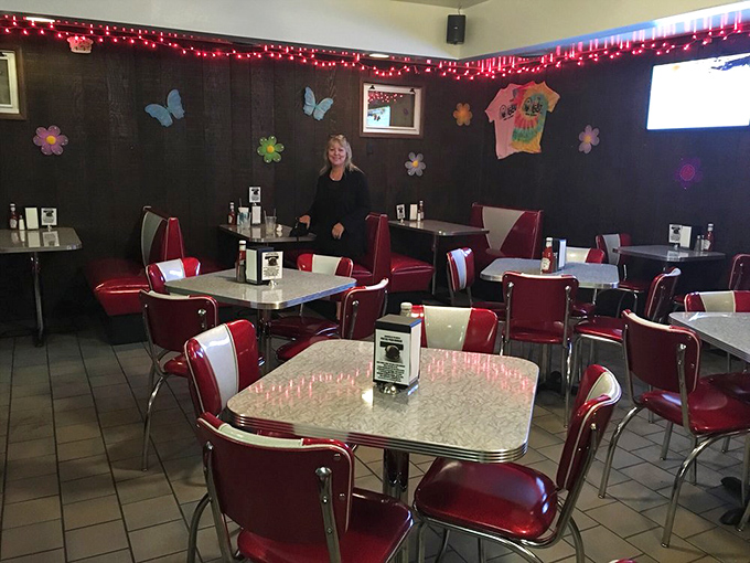 Classic red vinyl booths and chrome-trimmed tables create that timeless diner atmosphere where memories are made one meal at a time.