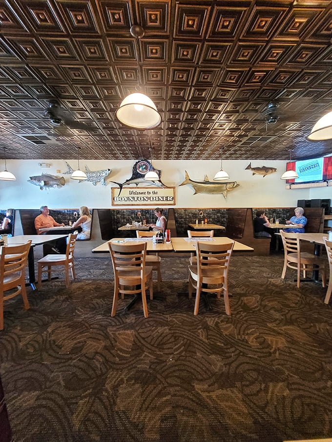 Those magnificent tin ceiling tiles and mounted fish create the perfect Florida diner atmosphere &ndash; where breakfast dreams and coastal charm collide deliciously.