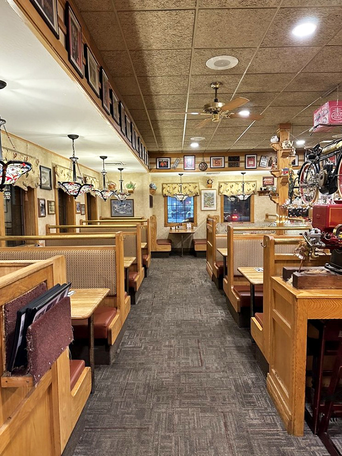 Wooden booths and Tiffany-style lamps create that perfect small-town diner atmosphere where breakfast dreams come true and diet plans go to die.