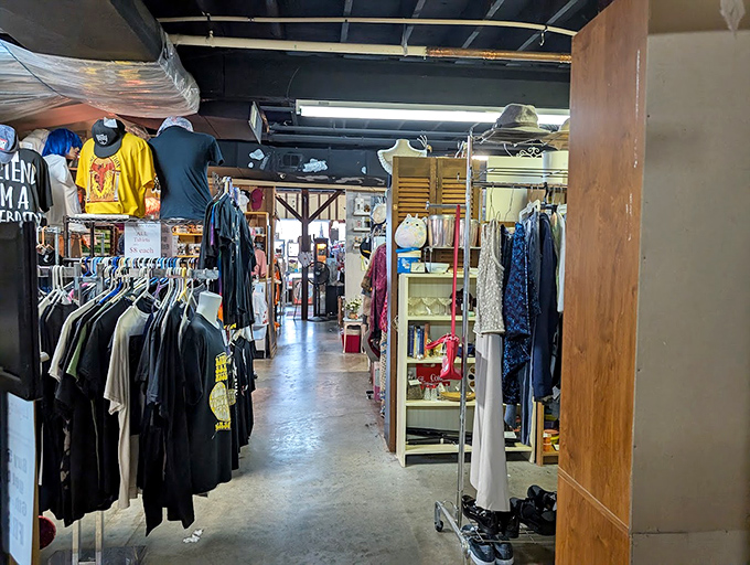 Racks upon racks of vintage clothing create corridors of fashion history. Each hanger holds someone's former identity, waiting for its second act.