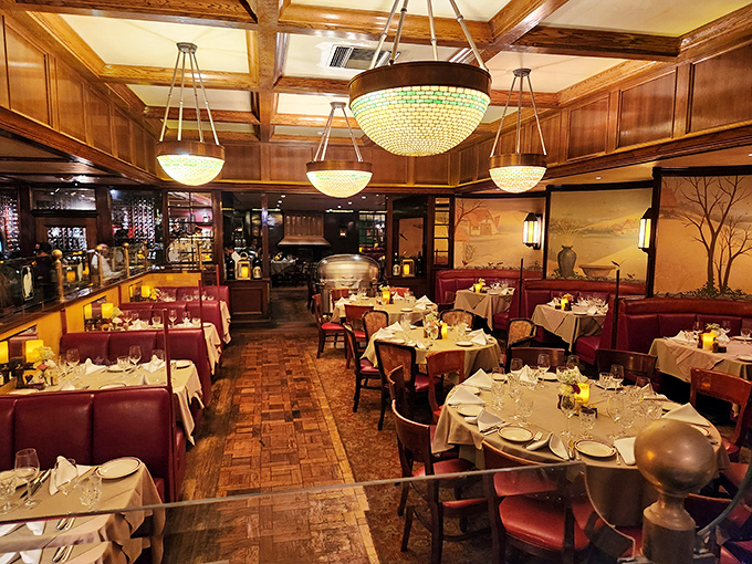 Step inside this mahogany-paneled temple where crystal chandeliers illuminate decades of perfectly executed carnivorous ceremonies.