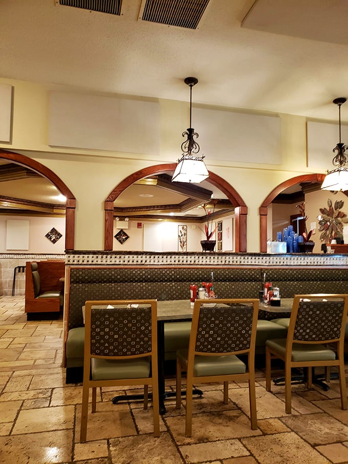 Wooden arches and warm lighting create that perfect diner ambiance. It's like stepping into a Norman Rockwell painting where comfort food dreams come true.