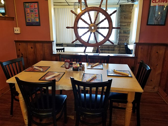 Nautical charm meets neighborhood comfort in this cozy dining room where ship wheels tell stories.