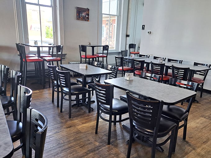 Simple, unpretentious dining space where conversations flow as freely as the coffee. No designer lighting fixtures here&mdash;just honest food and the warm buzz of community.