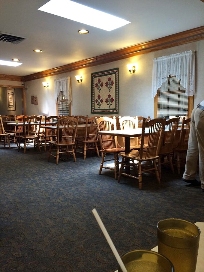 Wooden chairs that have witnessed countless family gatherings, quilts on walls, and lace curtains&mdash;this dining room feels like Grandma's house, if Grandma could cook for 100.