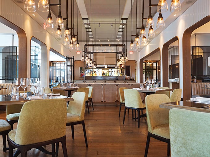 Where pendant lights dance overhead and every seat feels like the best table in the house.