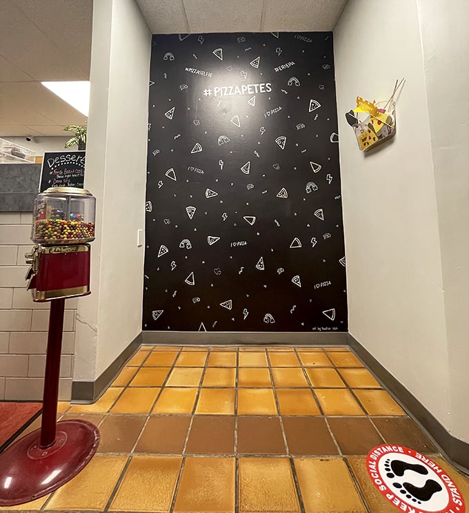 The Instagram-worthy pizza slice wall isn't just for show&mdash;it's the perfect backdrop for the inevitable "before" photos. The "after" photos never happen because, well, pizza.