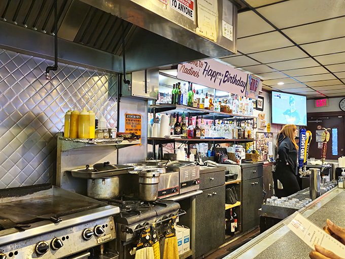 Behind the bar at Nadine's, where birthday celebrations meet breakfast preparations. The real magic of Pittsburgh happens in kitchens just like this one.