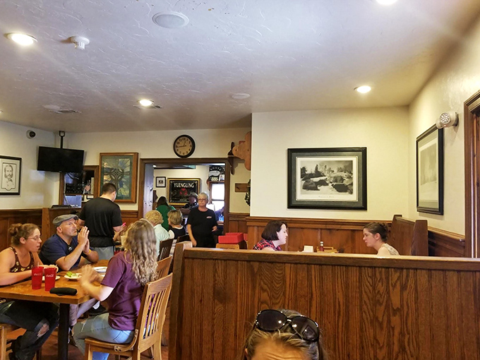 Inside, warm wood paneling and historical photos create that "everybody knows your name" vibe&mdash;the kind of place where comfort food meets comfortable conversation.