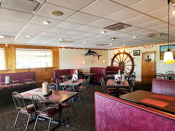 Nautical charm meets cozy comfort in Meding's dining room, where that ship's wheel isn't just decoration &ndash; it's steering you toward seafood nirvana.
