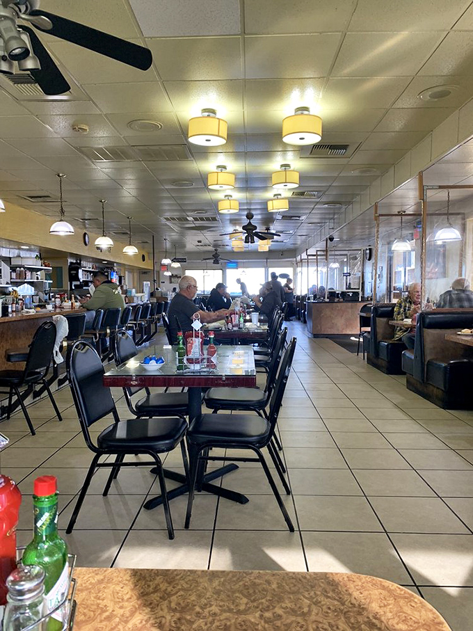 Inside, ceiling fans lazily spin above a sea of tables where breakfast dreams come true. This is democracy in dining&mdash;everyone equal before the pancake.