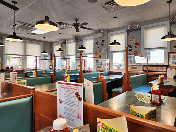Classic diner booths where strangers become neighbors and calories don't count. The pendant lights have witnessed countless "I shouldn't, but I will" moments.