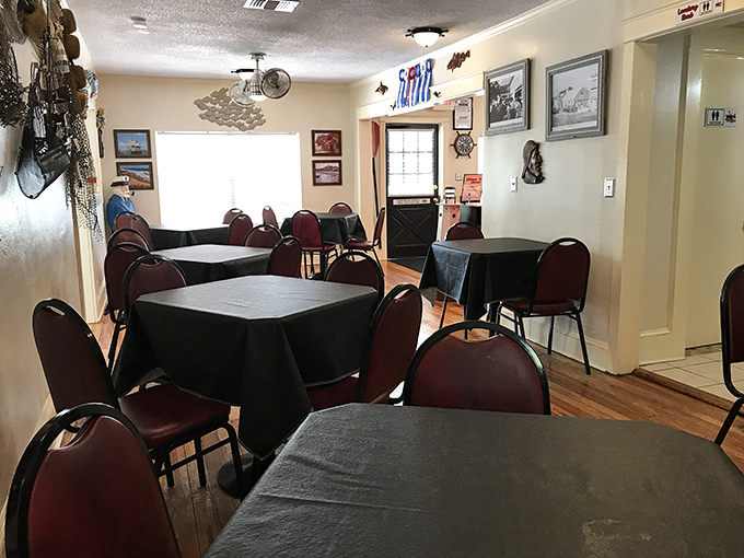 Inside, nautical charm meets no-nonsense dining. Those burgundy chairs have cradled countless seafood enthusiasts in their quest for the perfect chowder experience.