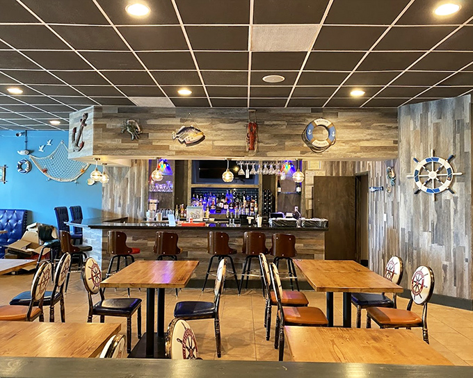 Nautical charm meets casual comfort in this dining room. Ship wheels on chair backs remind you what's about to dock on your plate.