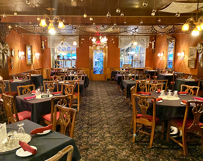 Surfboards line the ceiling like a museum of wave-riding history, while bamboo dividers create cozy nooks for morning feasts and coffee confessions.